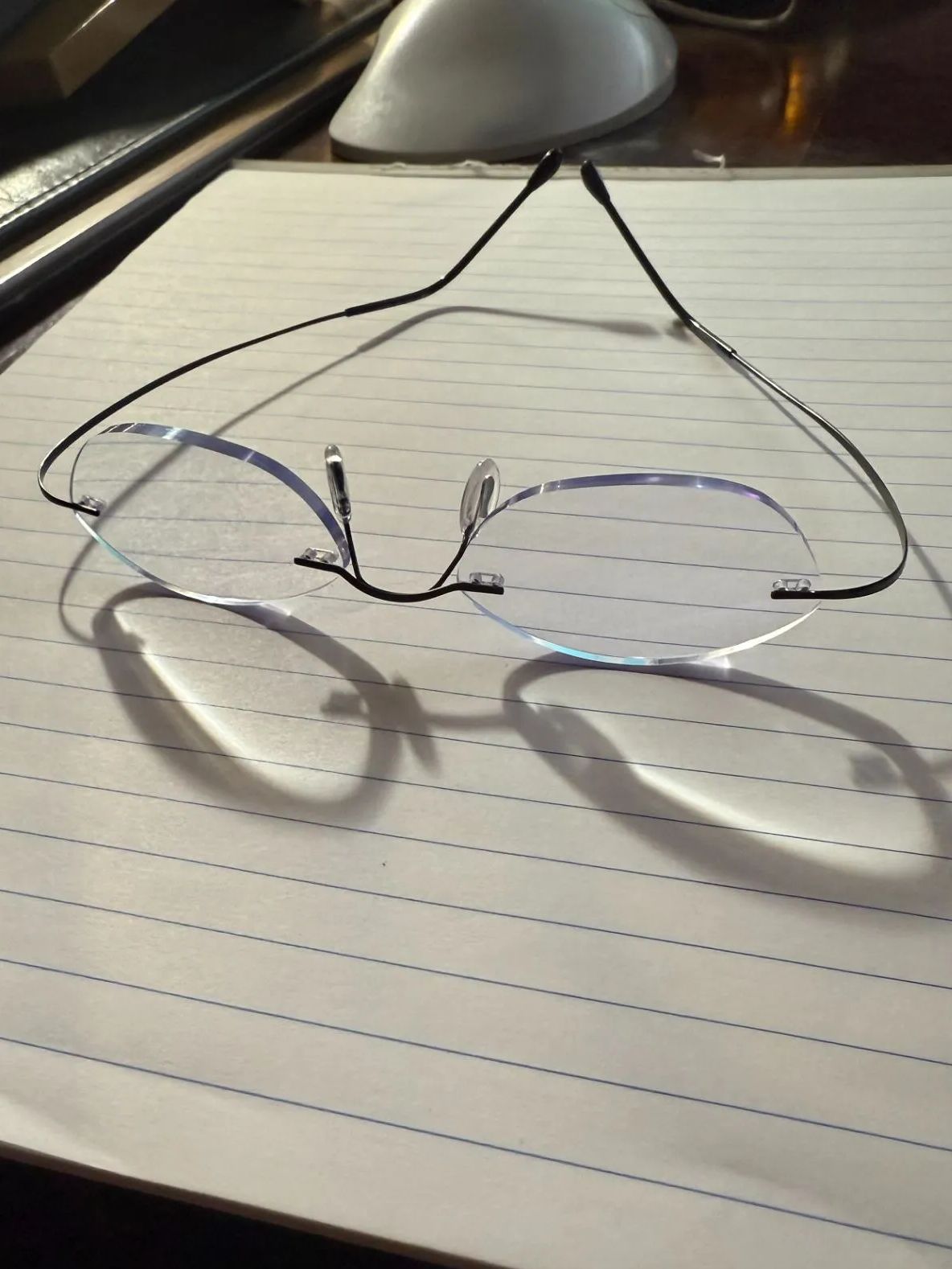 Black Flexible Oval Rimless Eyeglasses - Marv